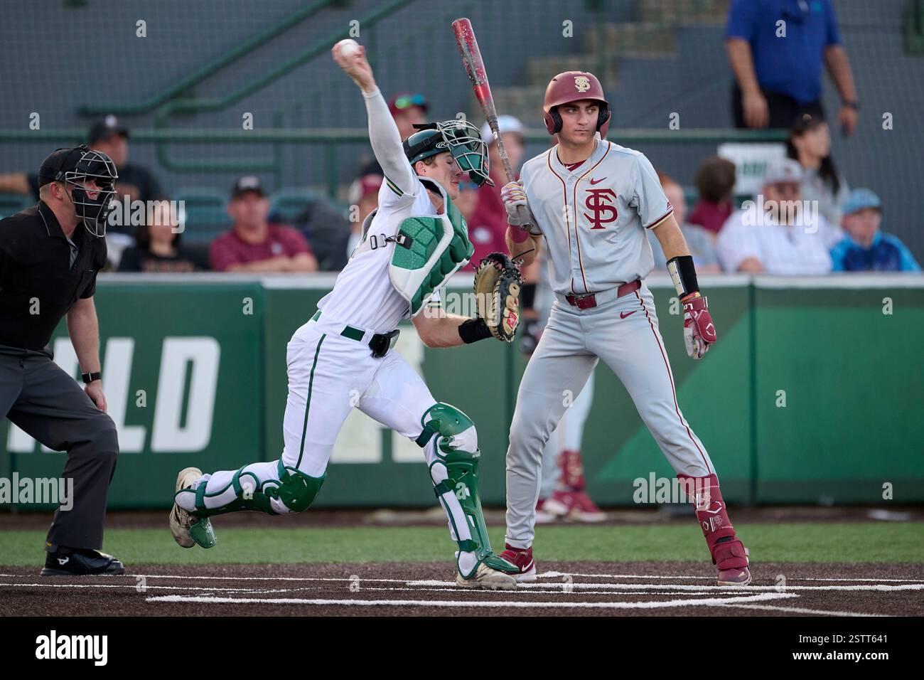 USF Bulls catcher Lance Trippel (20) throws a runner out on a stolen ...