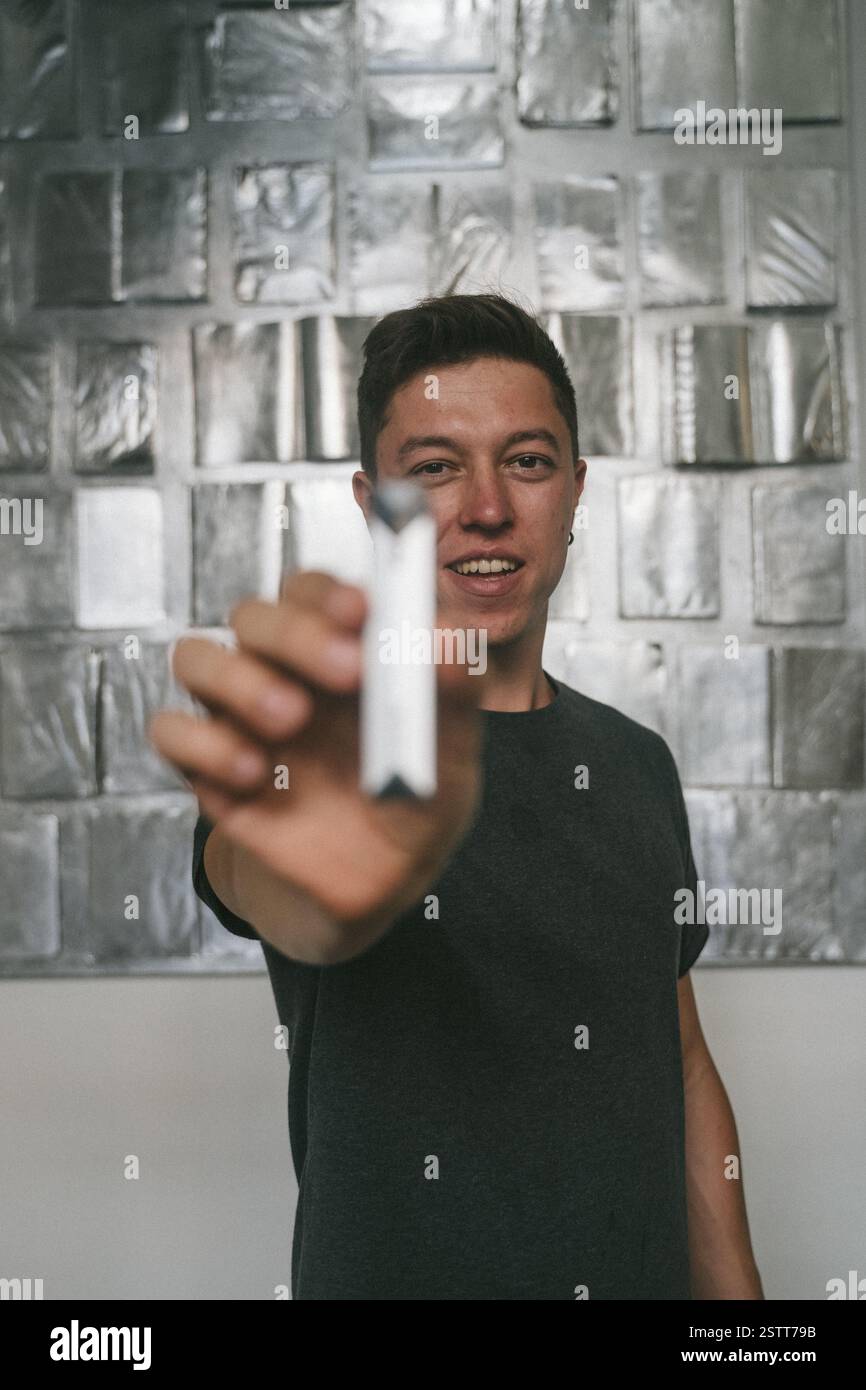 Concept of bad guy with top secret information. Man holding USB momory ...