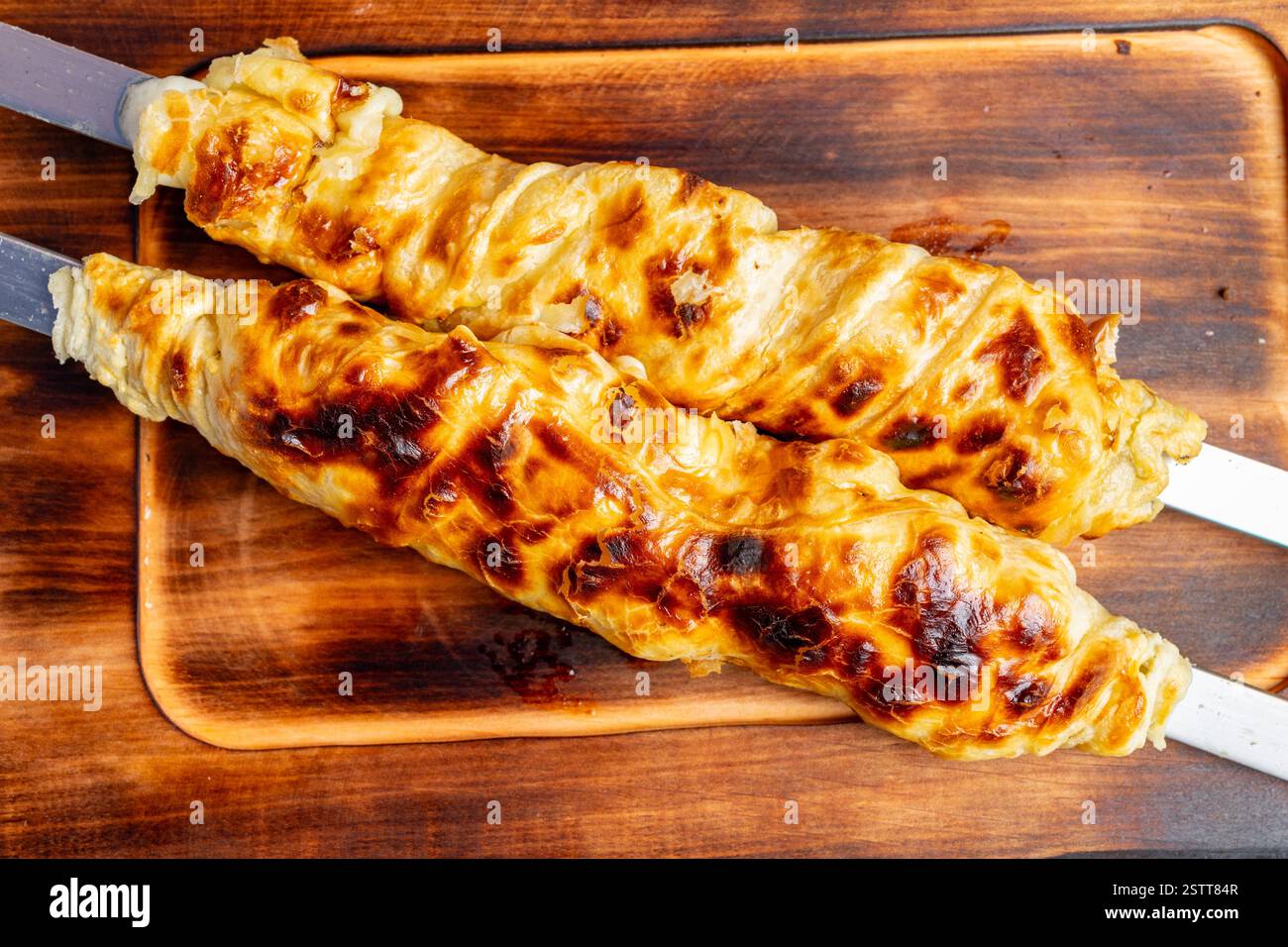 Delicious kebabs are perfectly grilled over an open flame, showcasing a ...