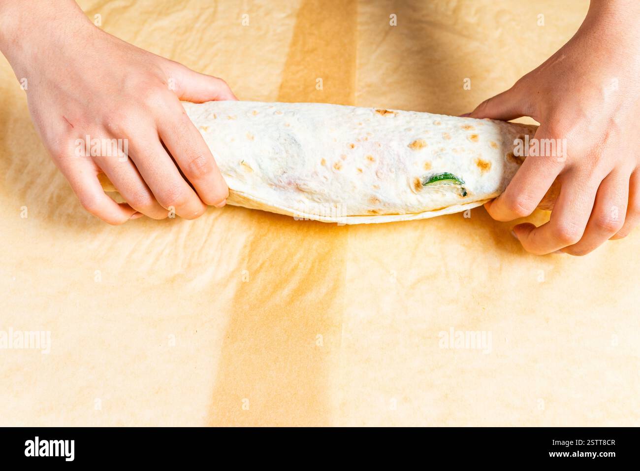 Process cooking tortilla rolls hi-res stock photography and images - Alamy