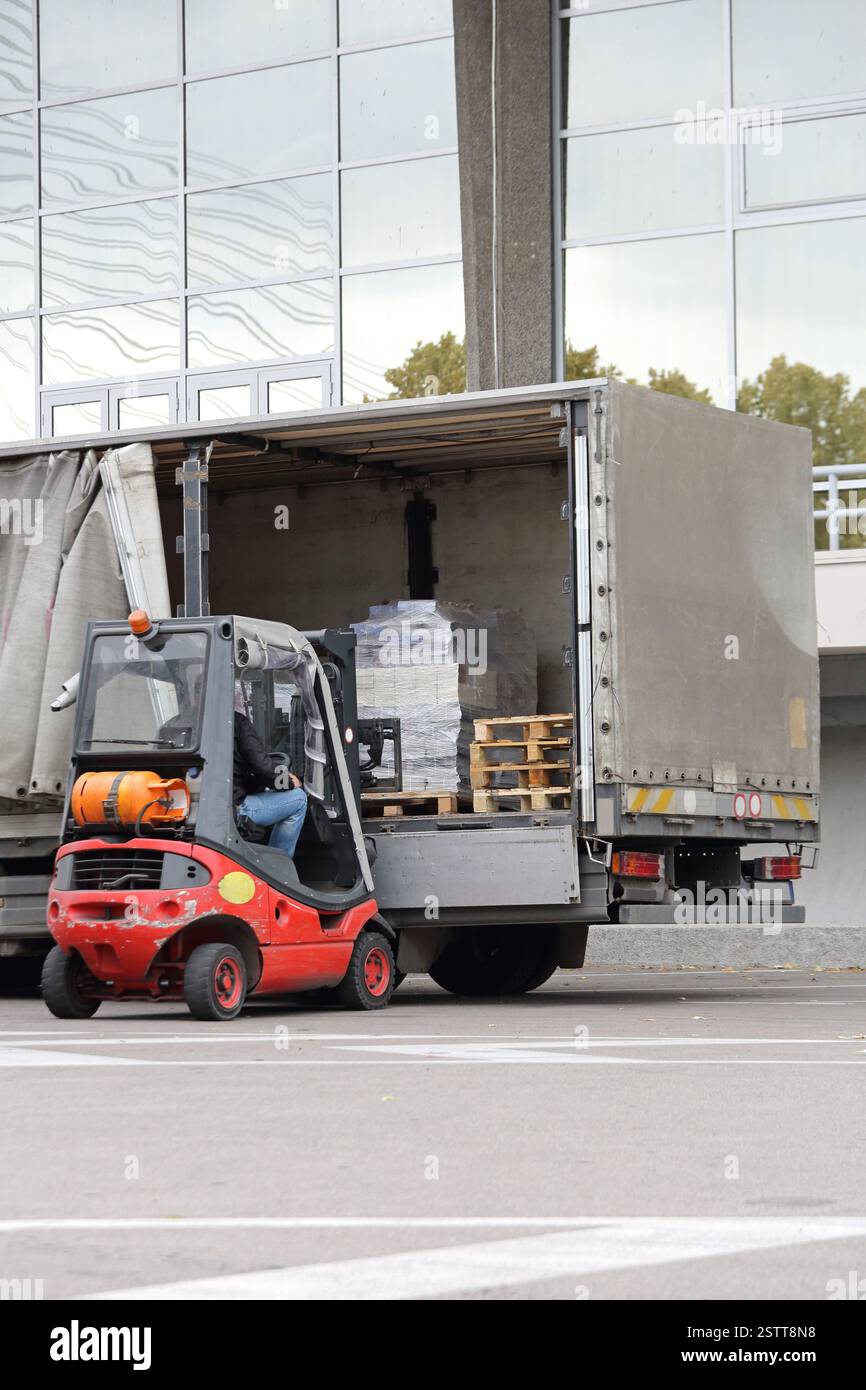 Forklift Loading Truck Stock Photo - Alamy