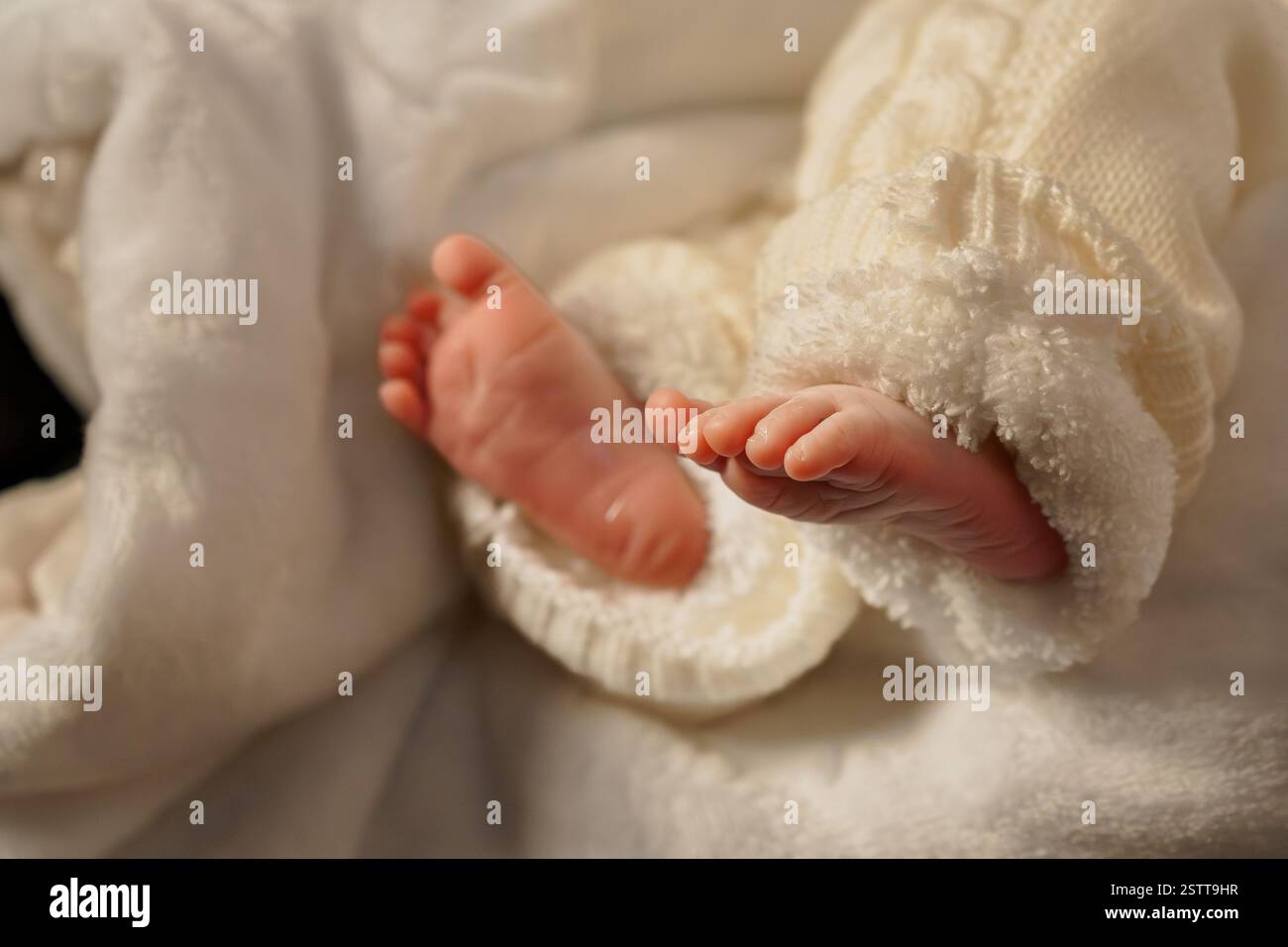 A Cozy Moment: Close-Up of a Sleeping Baby's Feet in Knit Sweater Stock ...