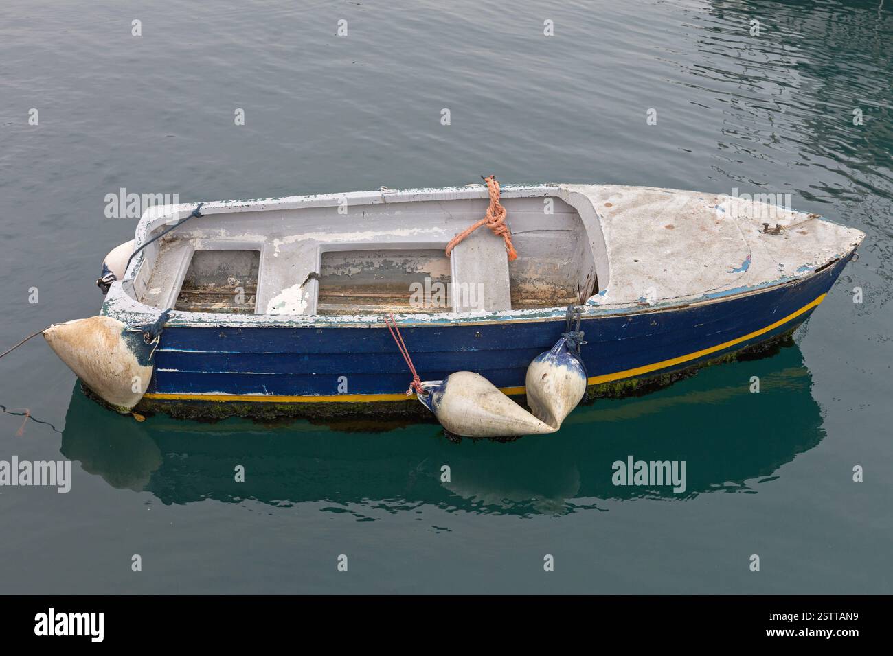 Small Dinghy Boat Moored at Sea Stock Photo - Alamy