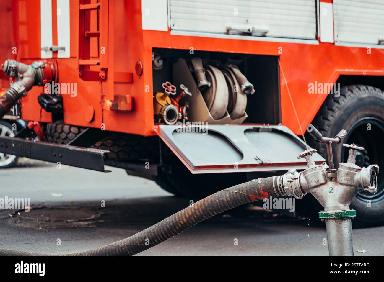 Fire Hydrant In Use During a Structure Fire Stock Photo - Alamy