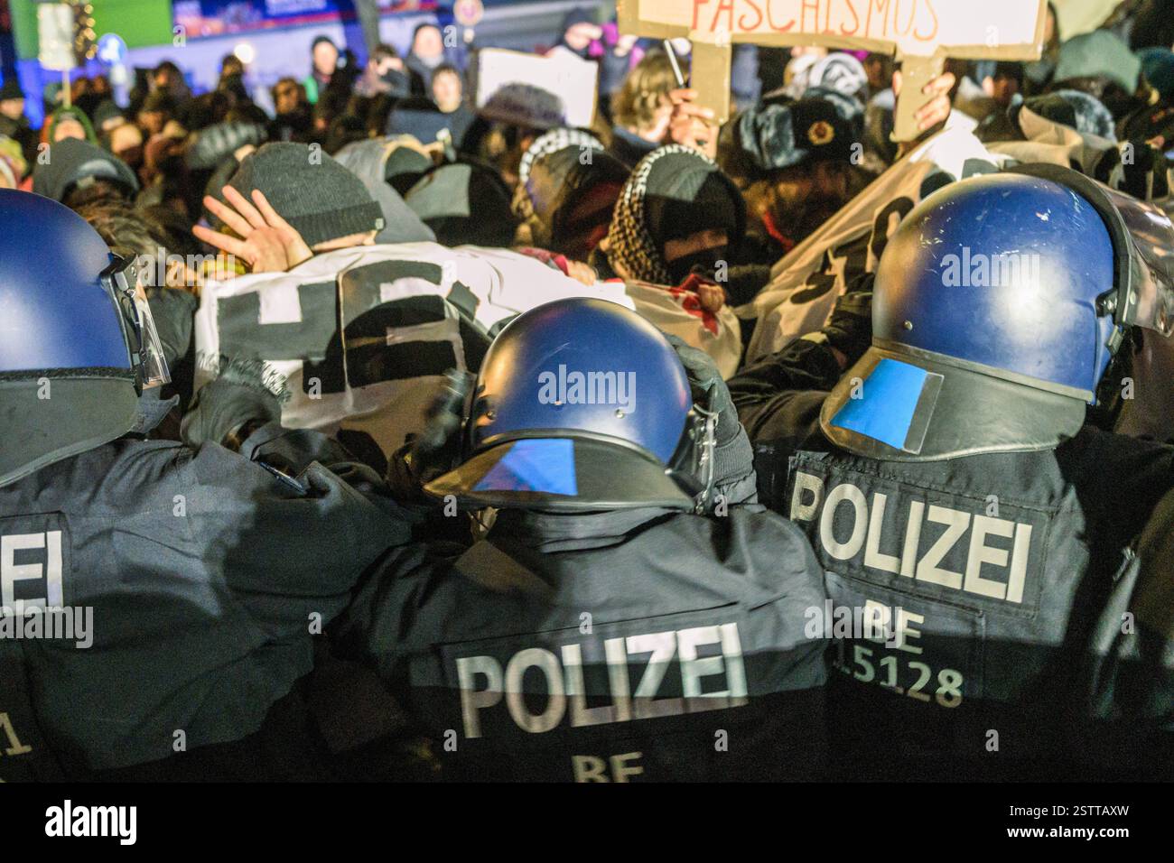 Berlin, Berlin, Germany. 19th Feb, 2025. Policemen hit the crowd behind ...