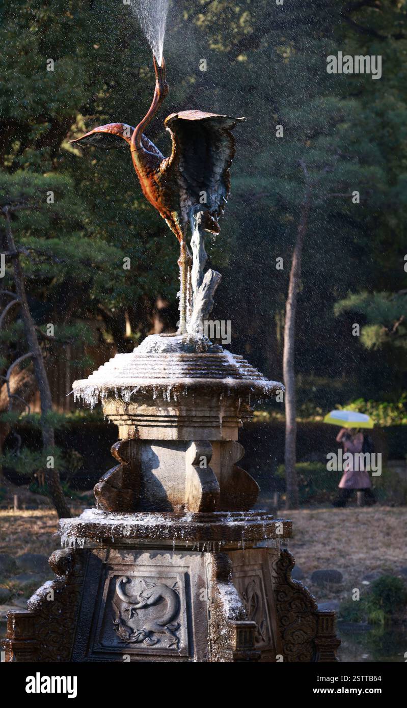 The Crane Fountain is frozen due to the severe cold at Hibiya Park in ...