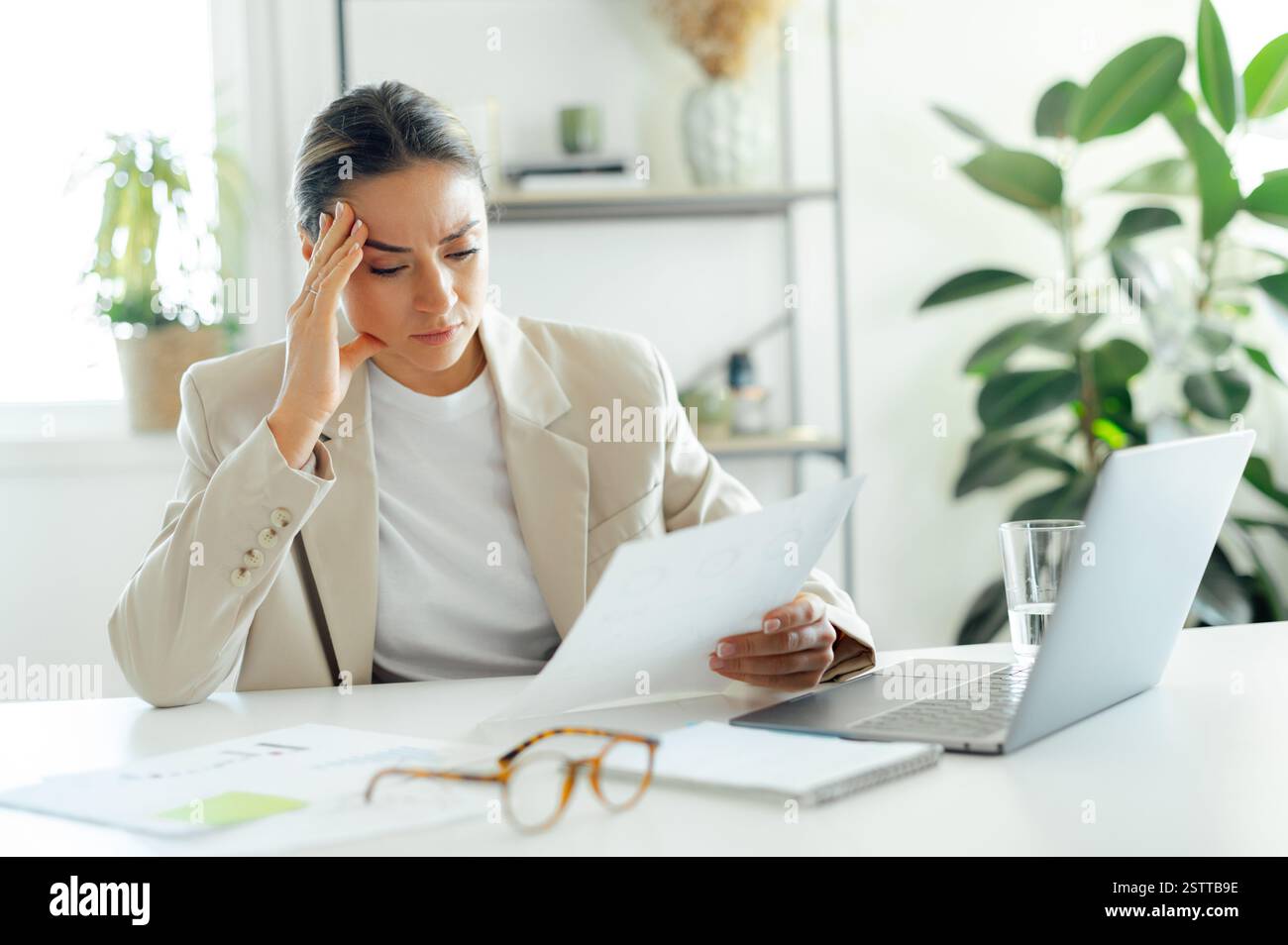Frustrated caucasian business woman, looking stressed because of ...