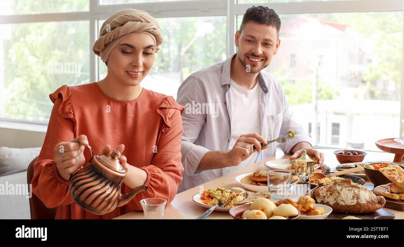 Happy muslim people eating together hi-res stock photography and images ...