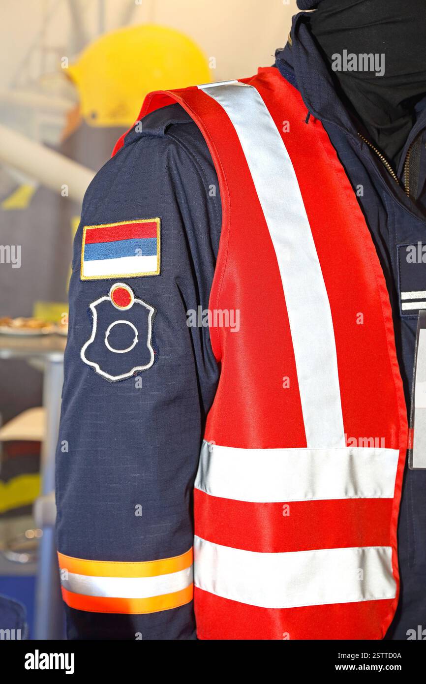 Man in uniform with red reflective safety vest hi-res stock photography ...