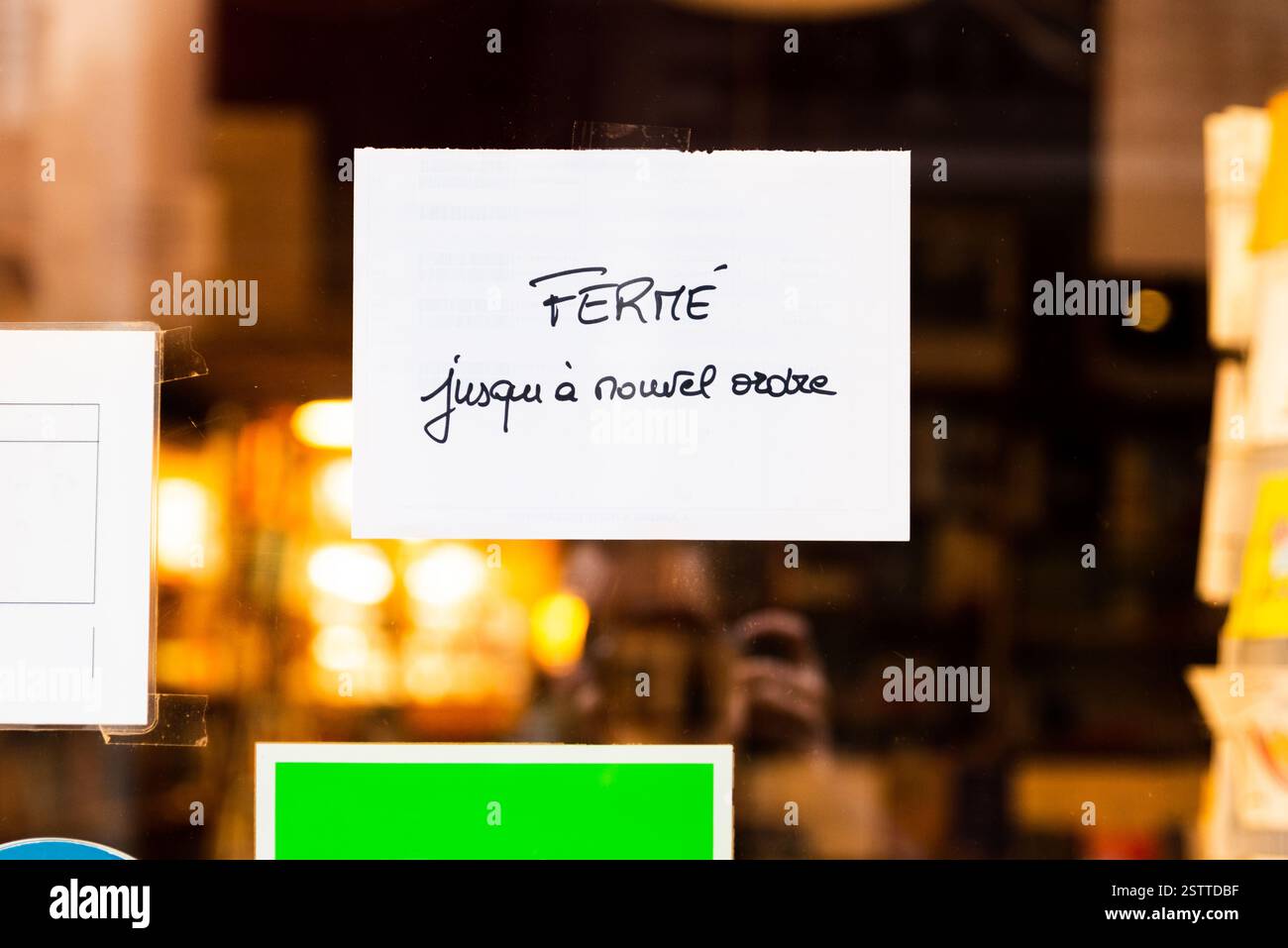 Handwritten french sign on a bookstore window reads closed until ...