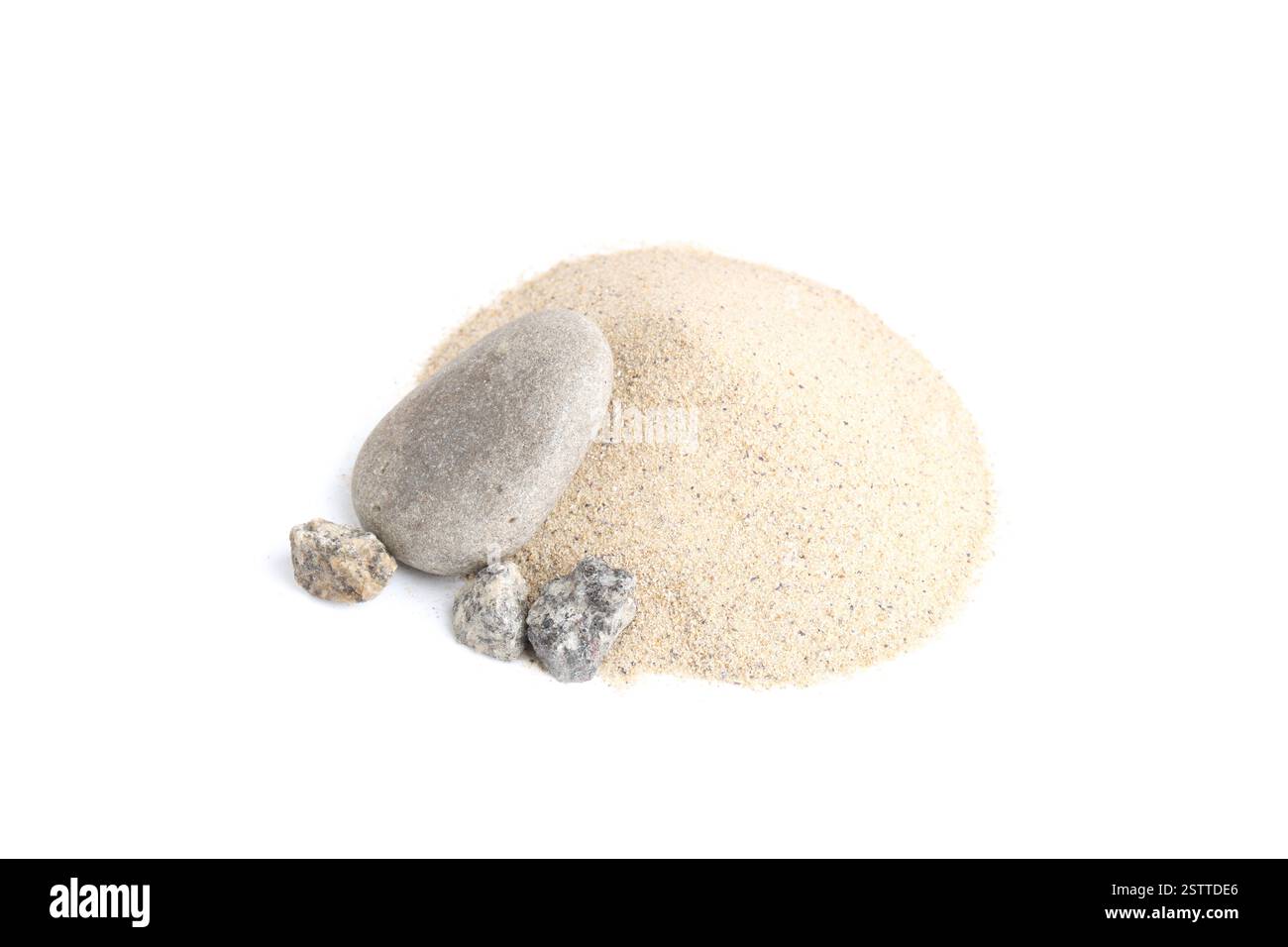 Heap of beach sand with stones on white background Stock Photo - Alamy
