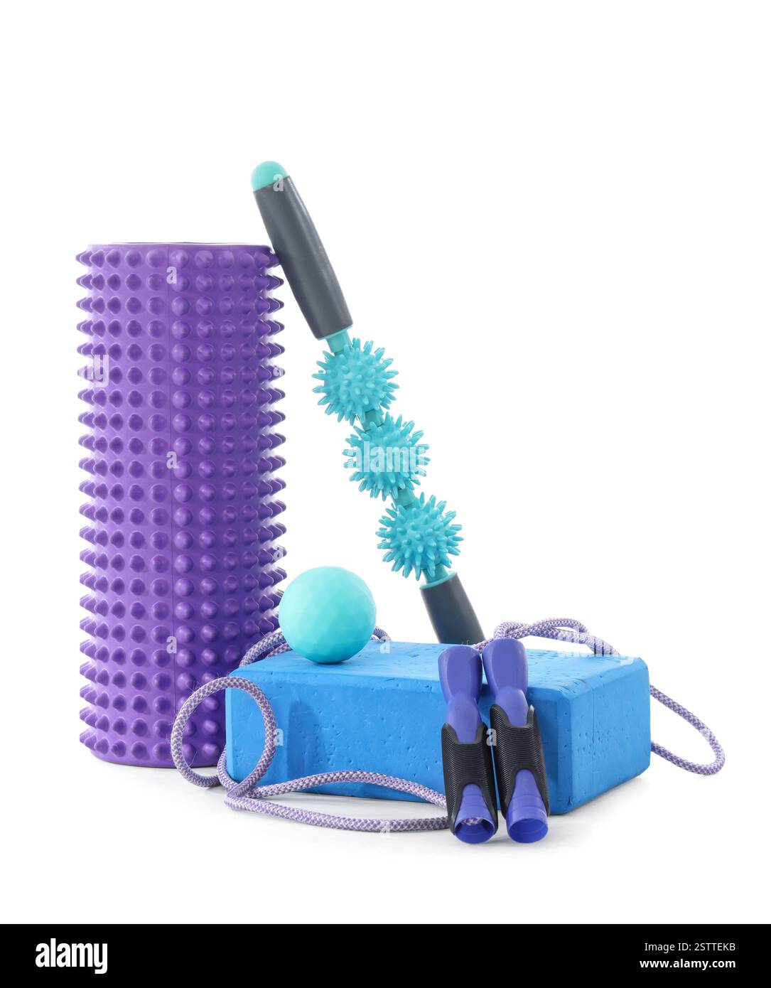 Massage rollers with skipping rope and block on white background Stock ...