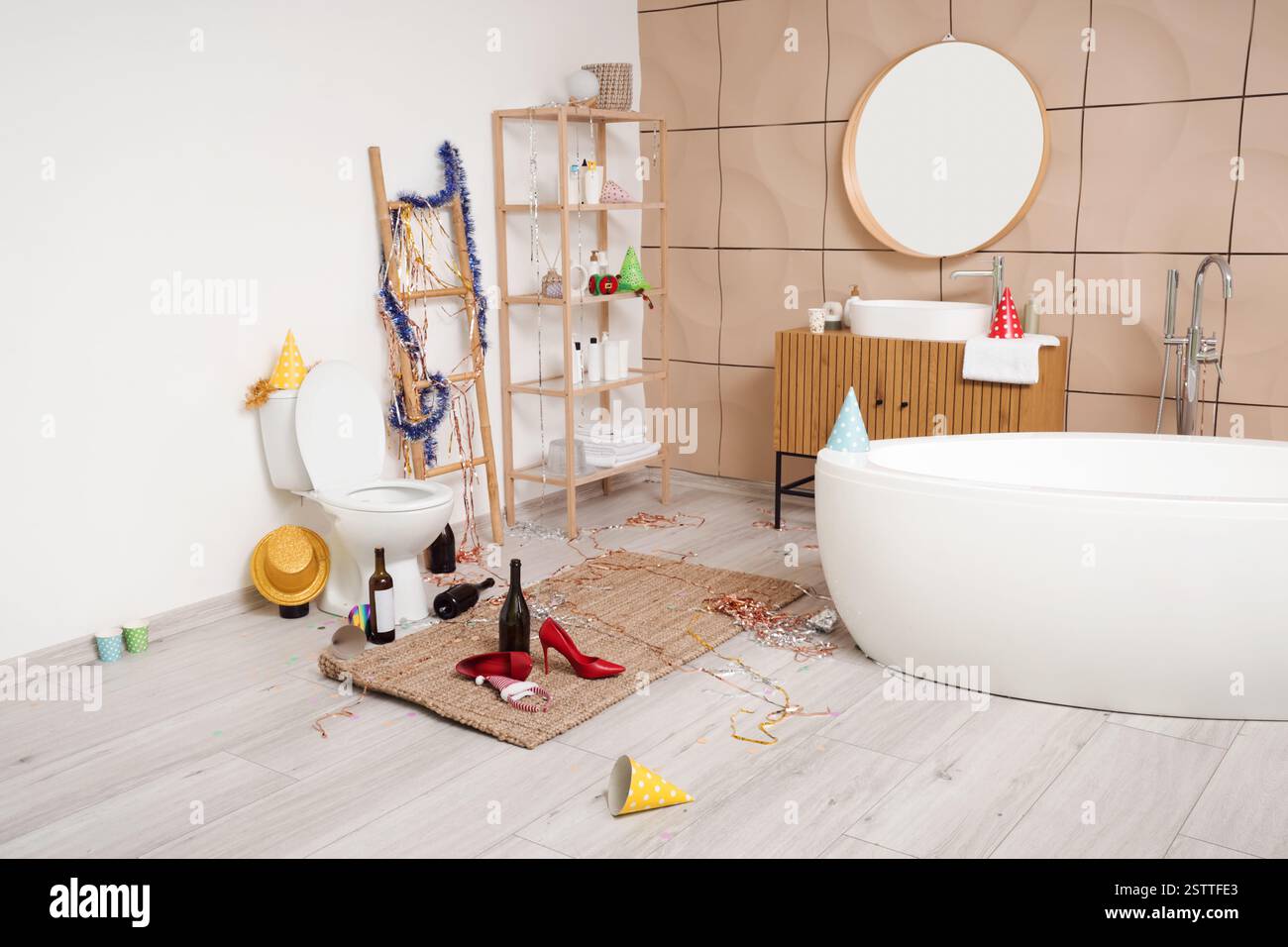 Interior of messy restroom after party with toilet bowl and decorations ...