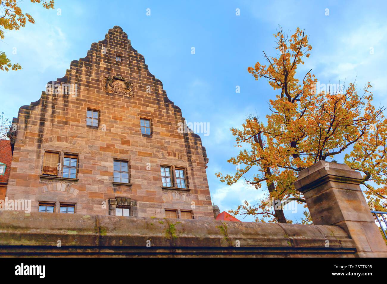 Historic building with stepped gable roof made of stone bricks with ...