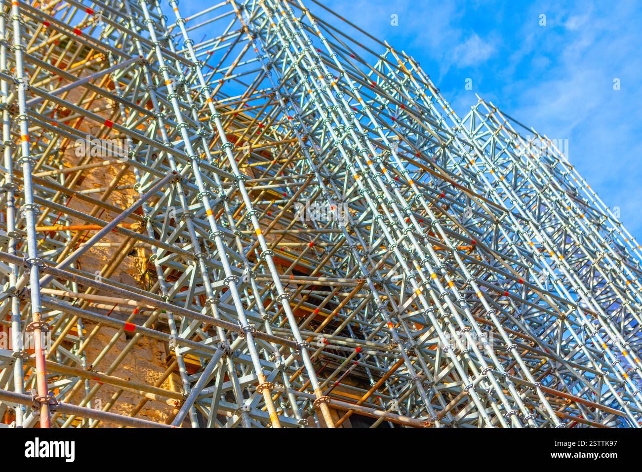Extensive metal scaffolding surrounds building under restoration ...