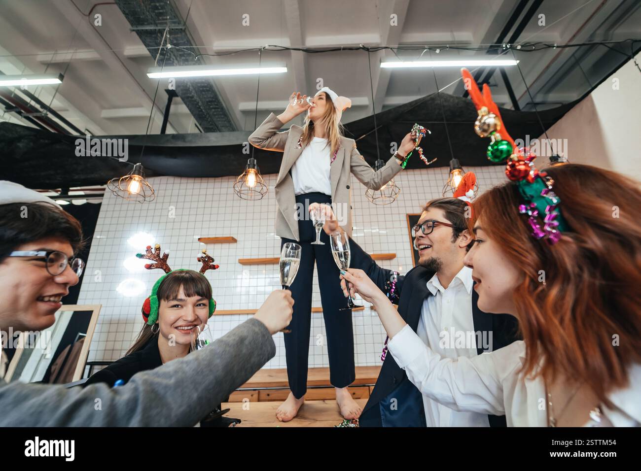 Happy colleagues in office celebrate special event together, smiling ...