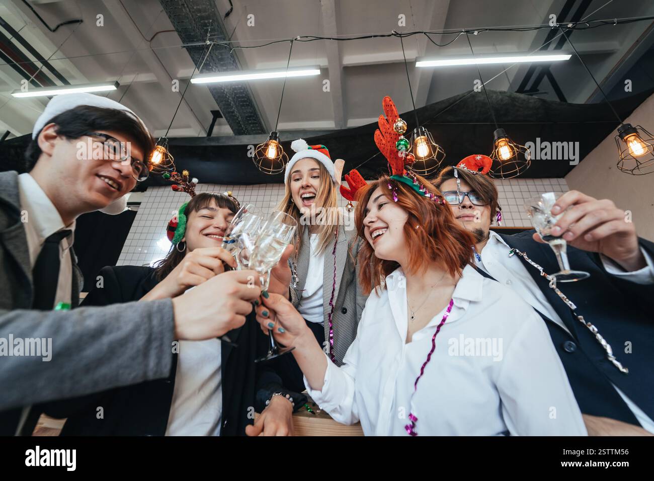 Happy colleagues in office celebrate special event Stock Photo - Alamy