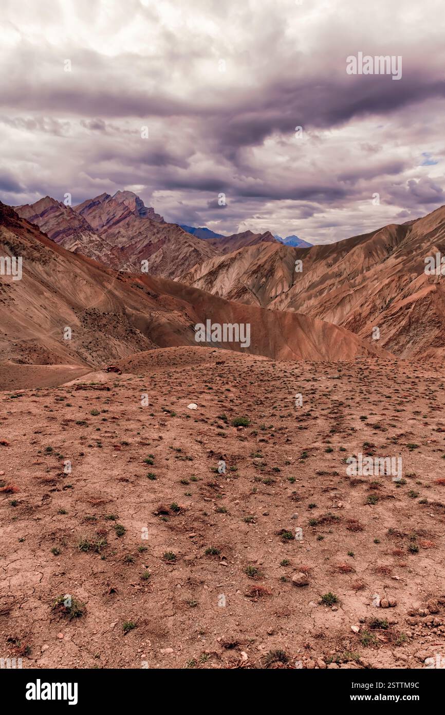 Thick monsoon clouds hang over the semi-desert landscape of the Zanskar ...