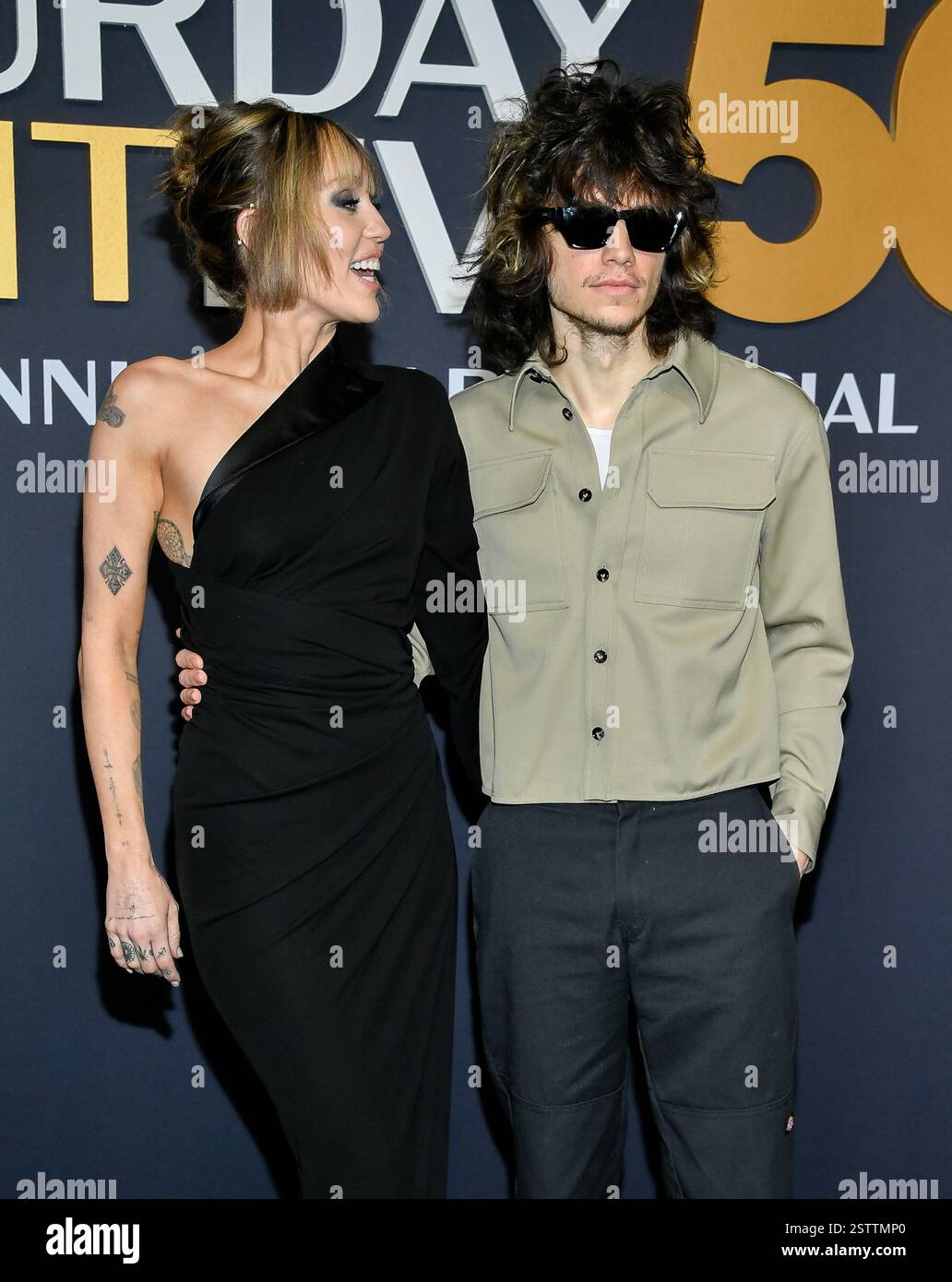 Miley Cyrus, left, and Maxx Morando attend the SNL50: The Anniversary ...