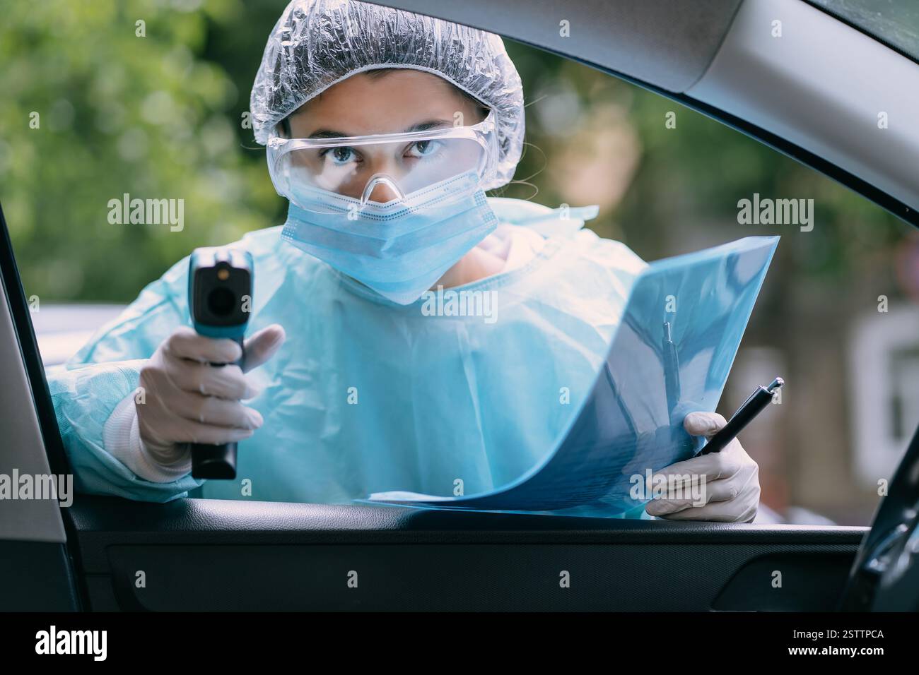 Doctor woman use infrared thermometer gun to check body temperature ...