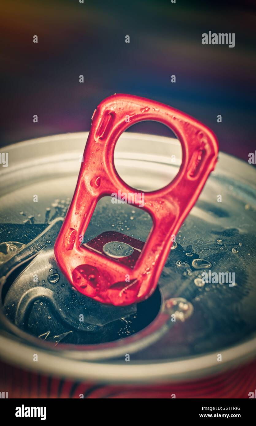 Macro photo of the lid of a can of fizzy drink open with the help of a ...