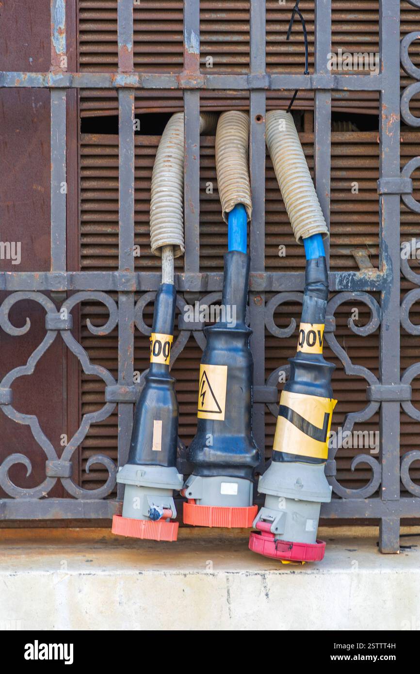 Three High Voltage Electric Energy Power Cables Stock Photo - Alamy