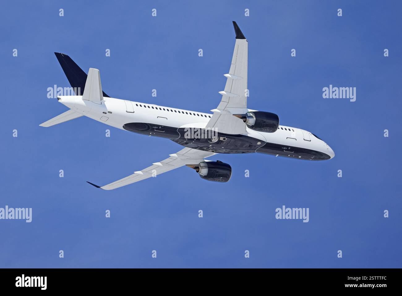 Commercial plane flying on a blue sky in Quebec, Canada Stock Photo - Alamy