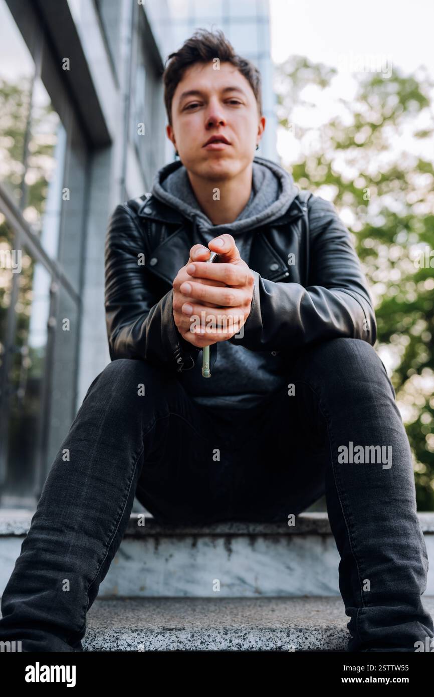 Guy sitting on top hi-res stock photography and images - Alamy