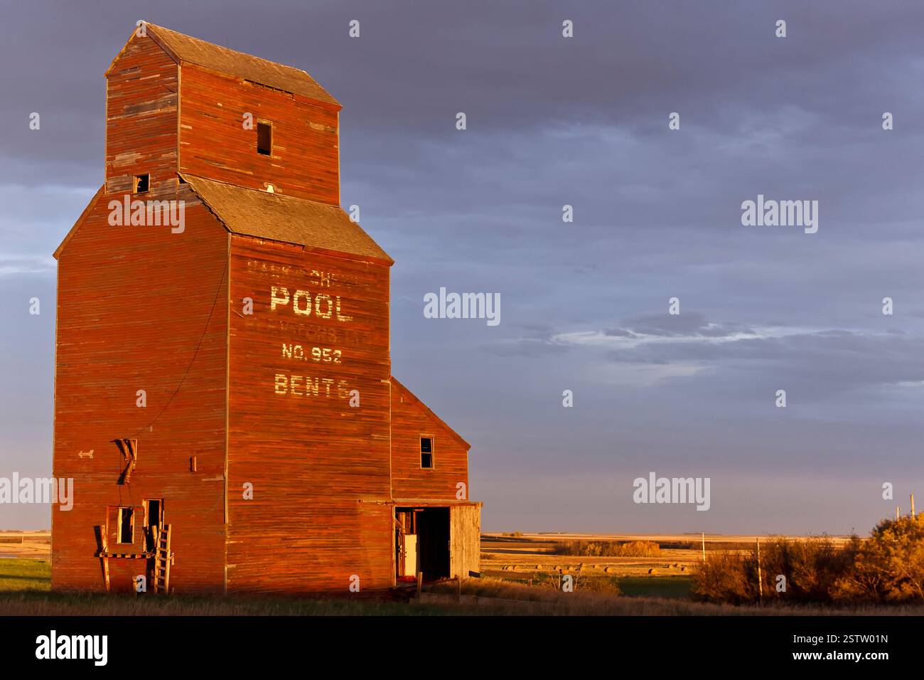 Red grain silo with the words "Pool" written on it. The silo is empty ...
