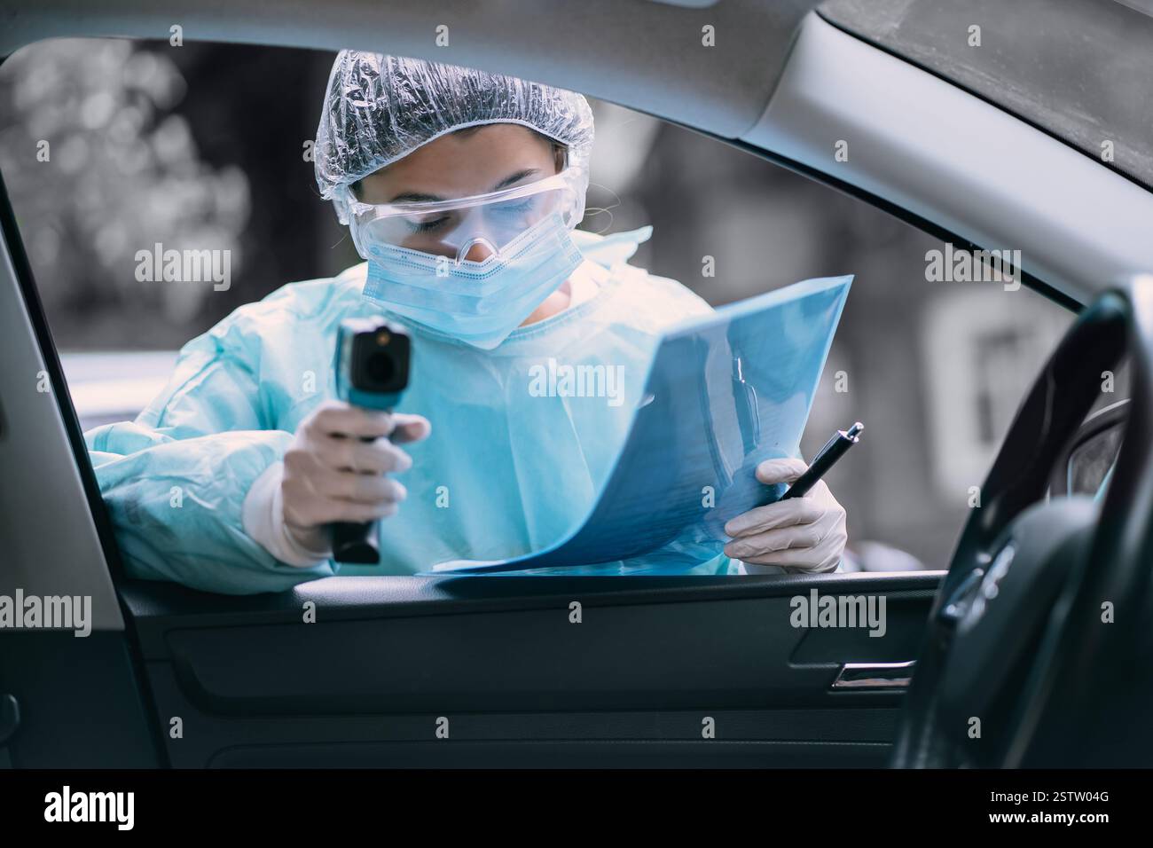 Doctor woman use infrared thermometer gun to check body temperature ...