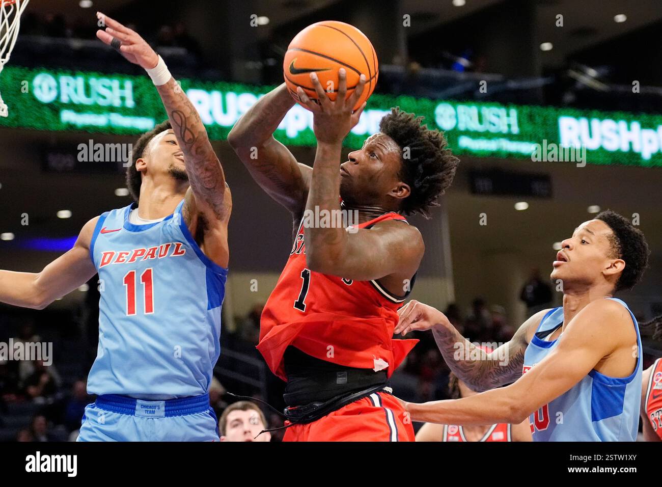 St. John's guard Kadary Richmond, center, drives to the basket against ...
