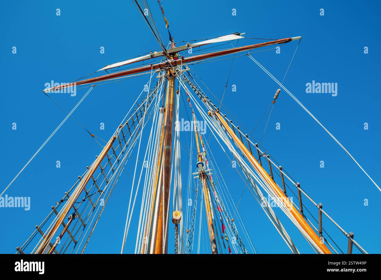 Old sailing ship wood mast, rigging of a sailing ship detail Stock ...