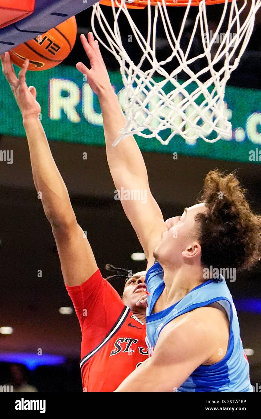 St. John's guard Simeon Wilcher, left, shoots over DePaul guard Jacob ...