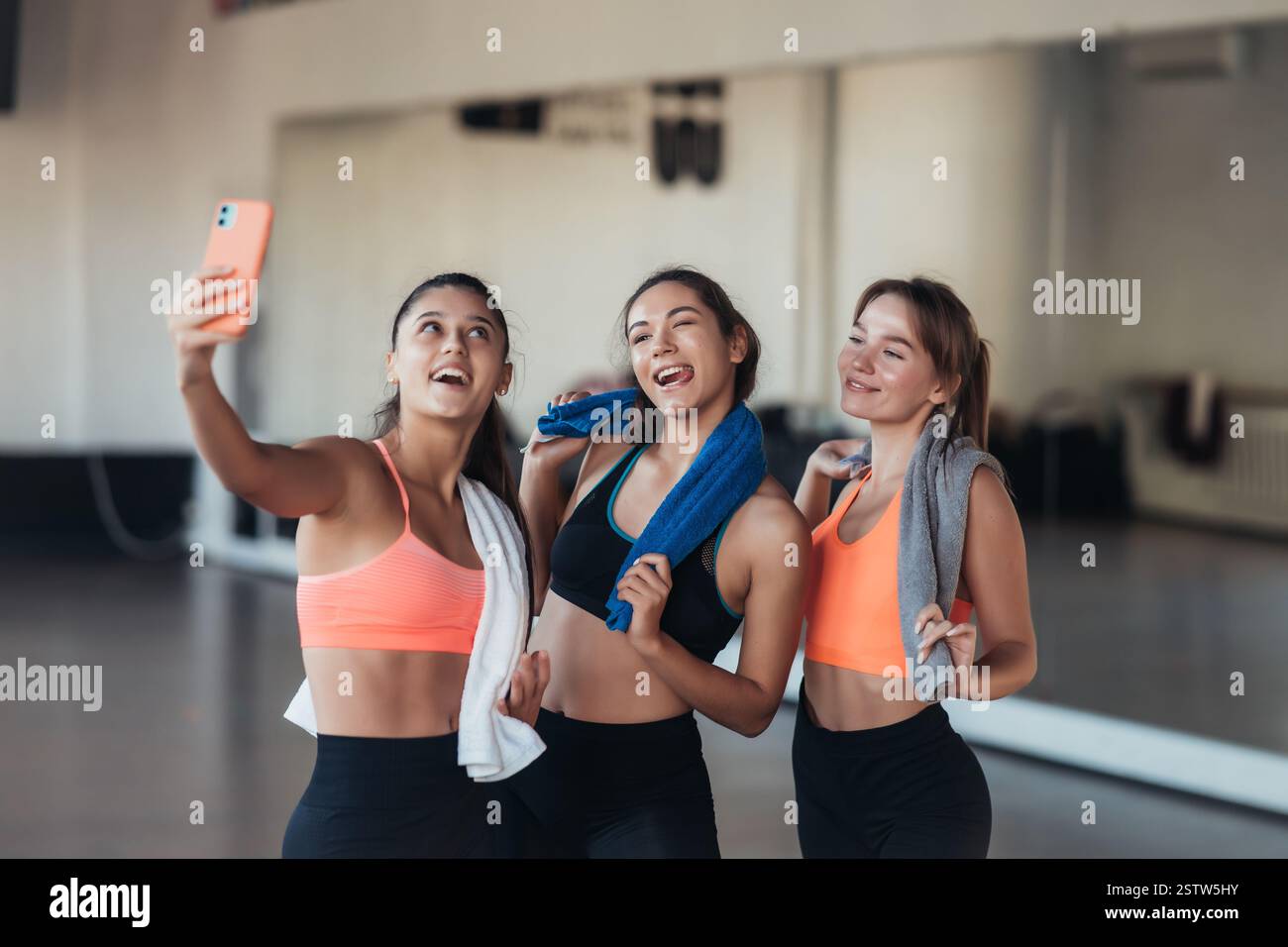 Two female friends taking a selfie photo after hard workout Stock Photo ...