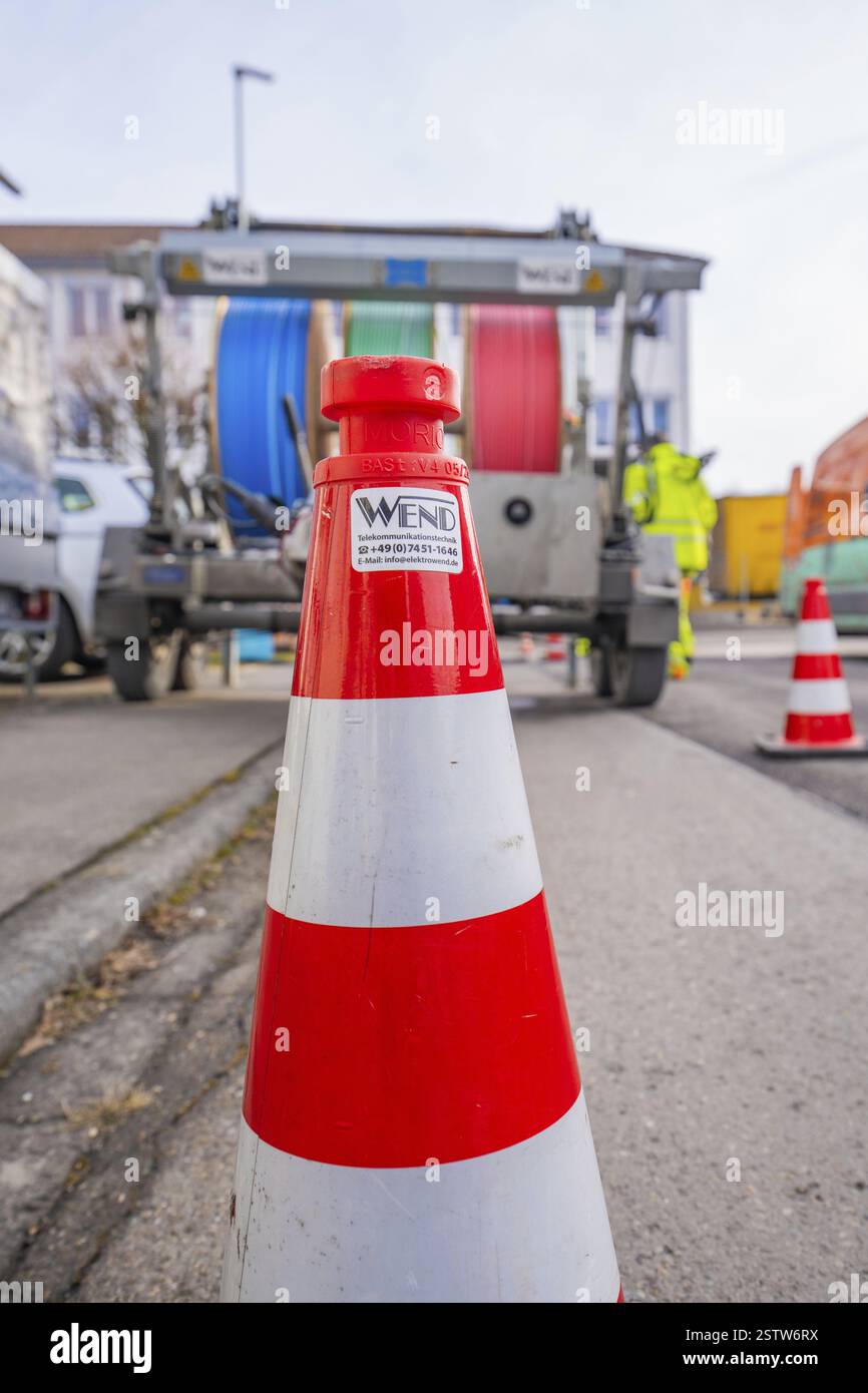 Traffic cone on a road in front of a construction site, Wend ...