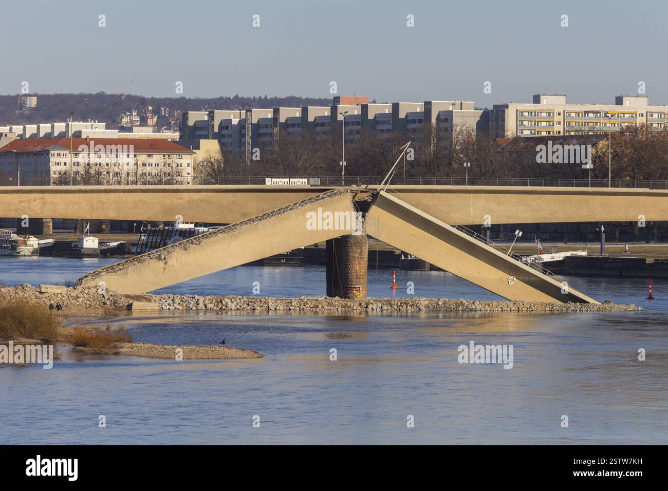 After the partial collapse of the Carola Bridge, a dam was built for ...