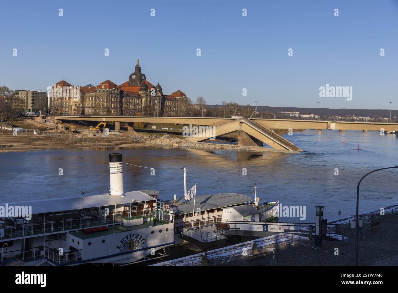 After the partial collapse of the Carola Bridge, a dam was built for ...