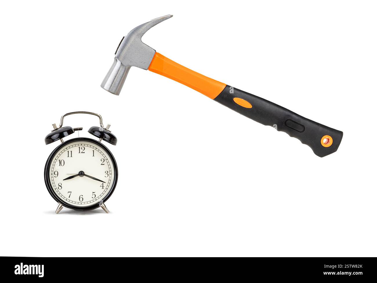 Hammer and Clock Concept: A conceptual shot of a hammer hovering above ...