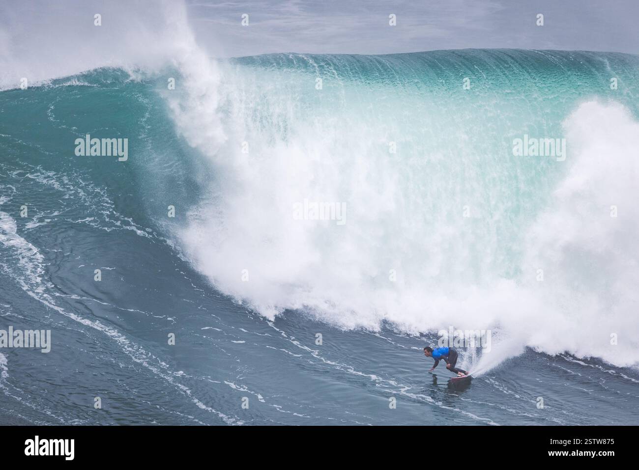 Nazare, Portugal. 18th Feb, 2025. Scottish surfer Ben Larg rides a wave ...