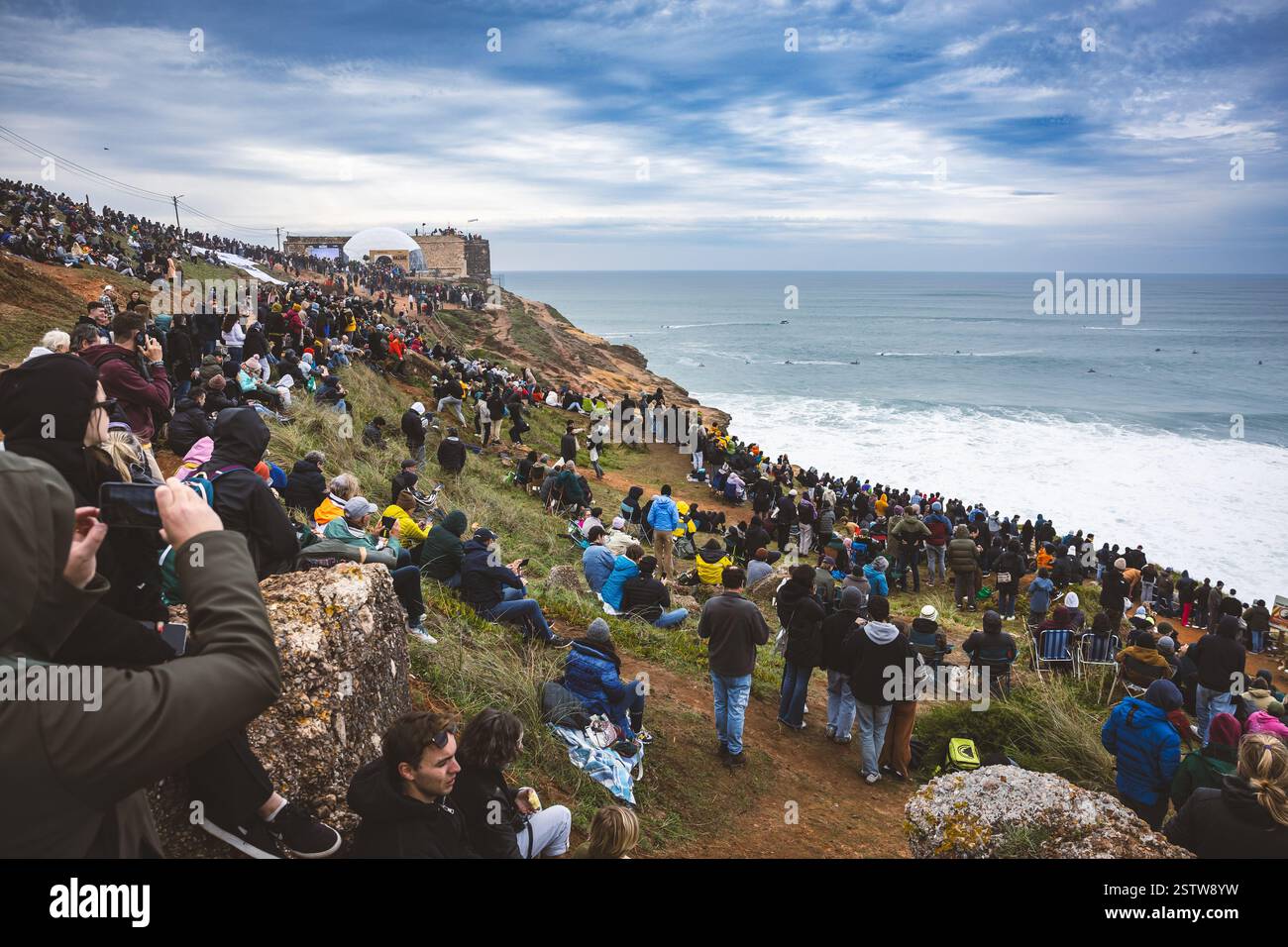 Nazare, Portugal. 18th Feb, 2025. Thousands of spectators watch from ...