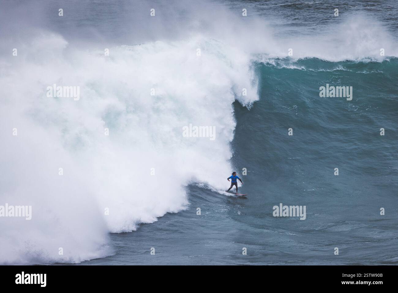 Nazare, Portugal. 18th Feb, 2025. Scottish surfer Ben Larg rides a wave ...