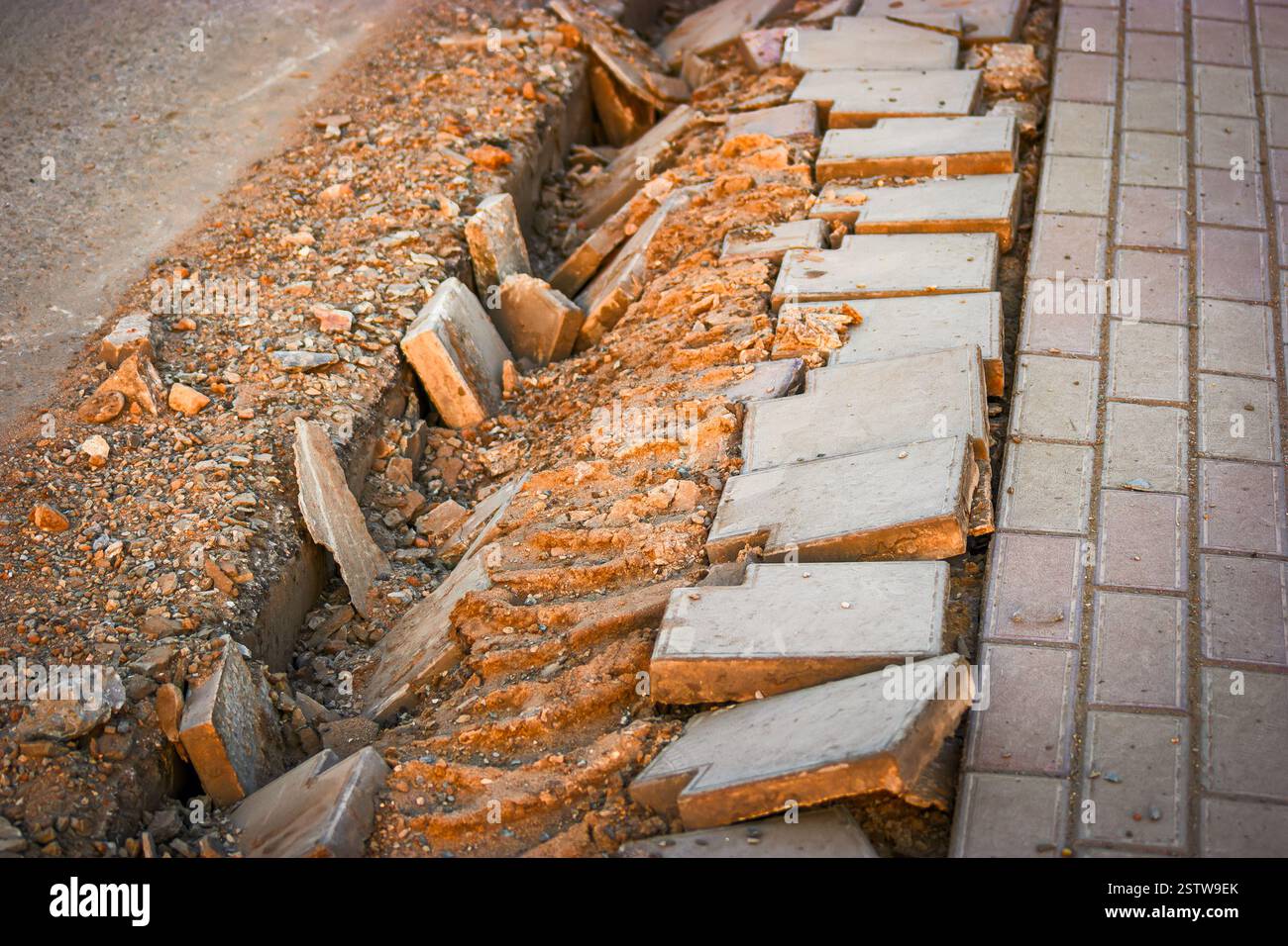 Worker installing old cobblestone block hi-res stock photography and ...