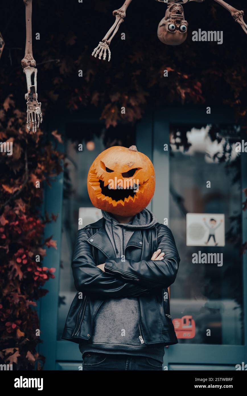 Guy with a pumpkin head poses for the camera Stock Photo - Alamy