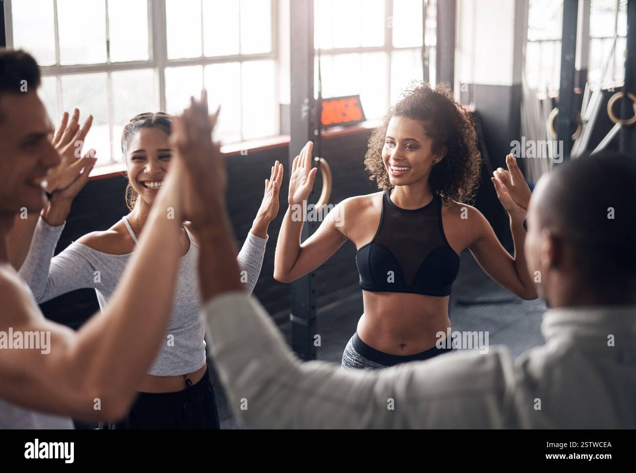 High five, team and people in gym for fitness, training and workout ...