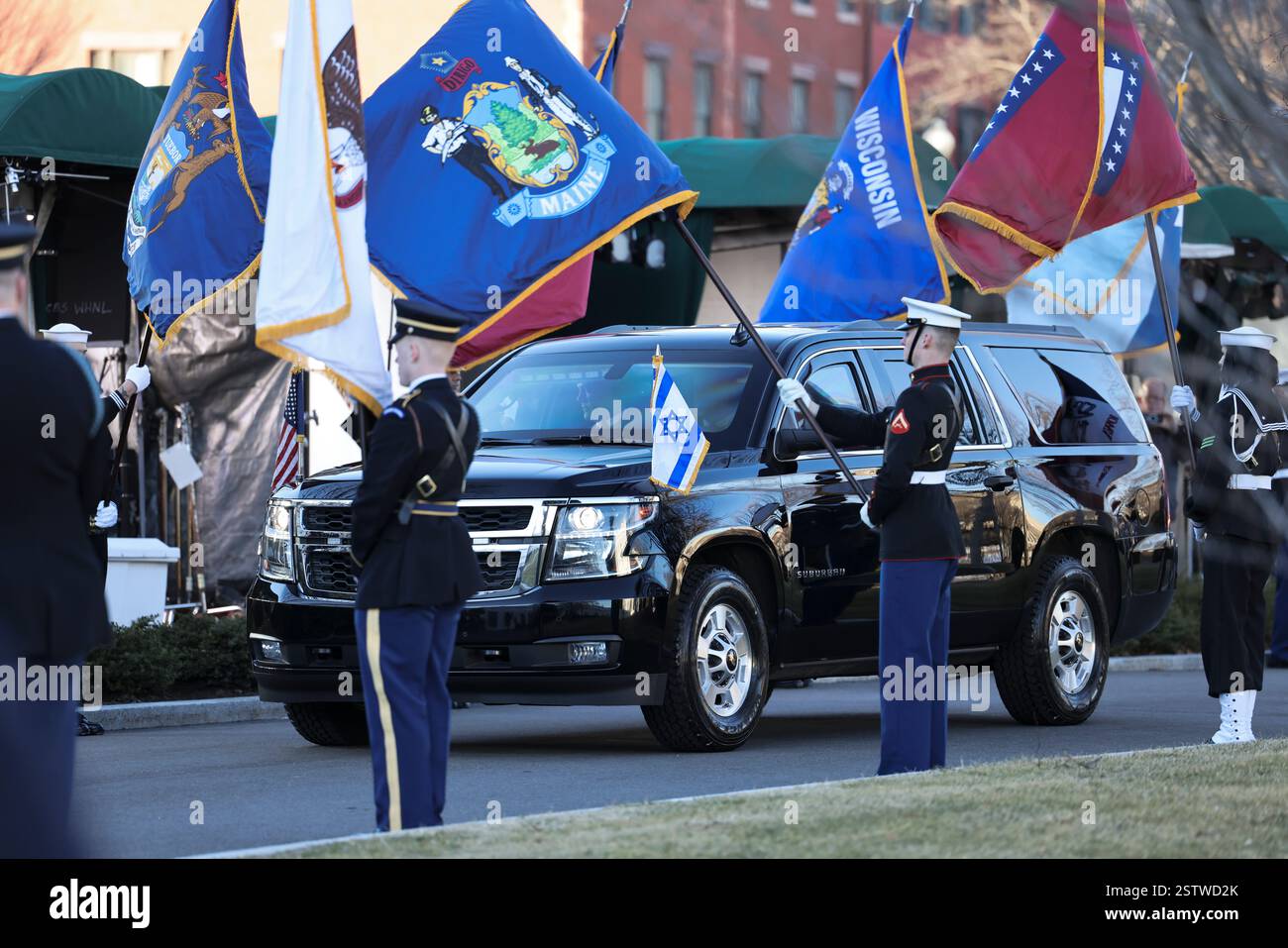 Members of the military honor guard hold U.S. state flags as Israeli ...