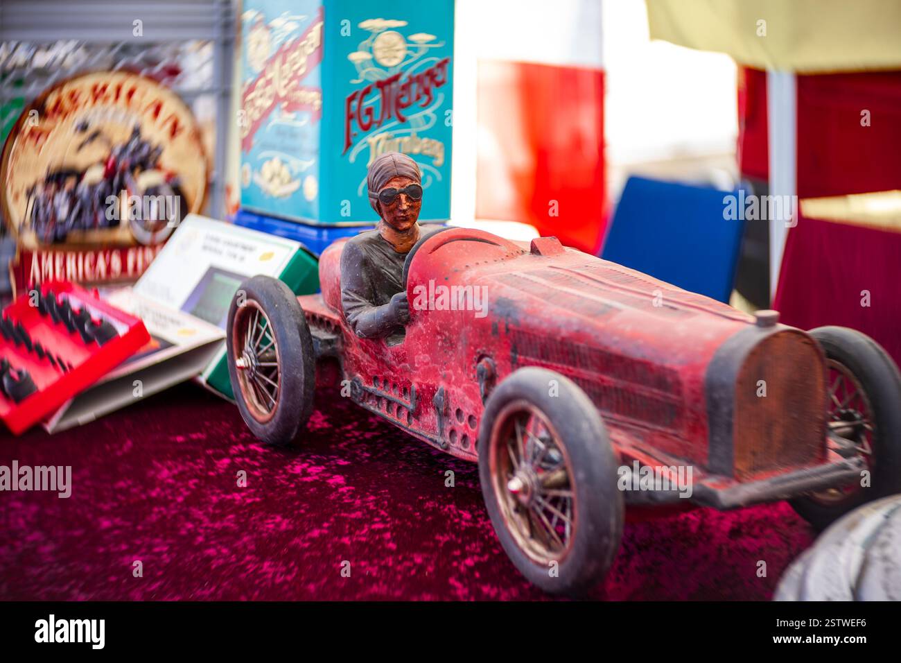 Toy racing car. Flea market at the exhibition. Art lens. Swirl bokeh. Die Oldtimer Show 2023 ...