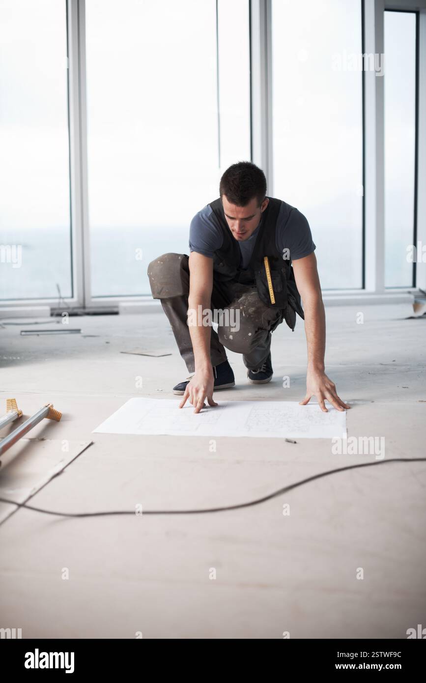 Man, blueprint and architect with construction site, planning and ...