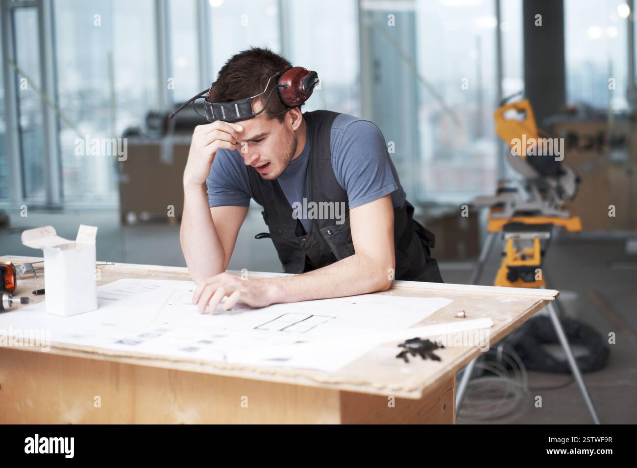 Man, blueprint and architect with construction site stress, engineering ...