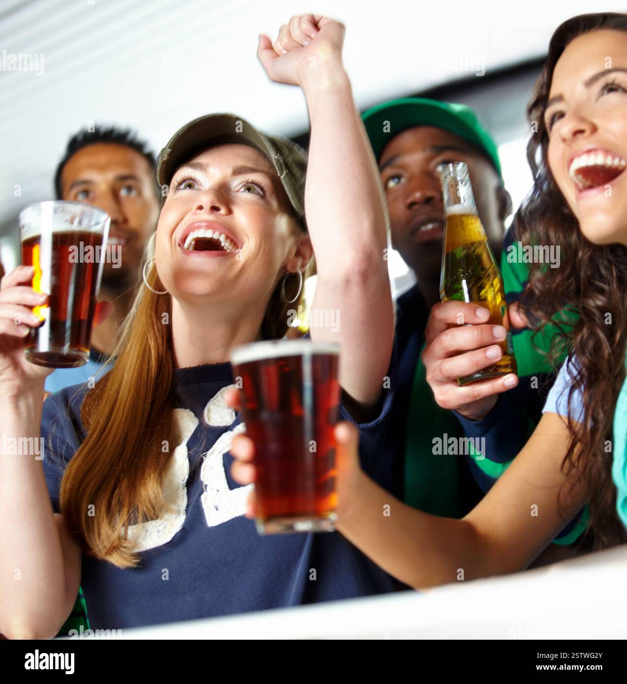 Beer, sports fans and football match celebration in pub for goal score ...