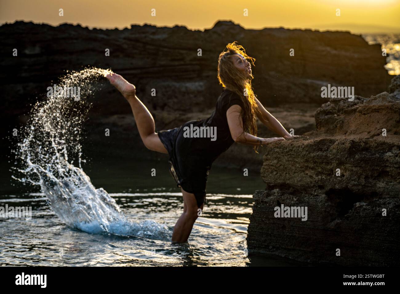 Young woman dancing in joy hi-res stock photography and images - Alamy